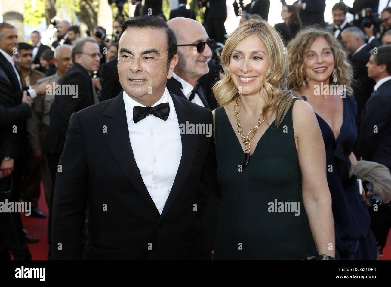 Carlos Ghosn with wife Rita attending the 'The Last Face' premiere ...