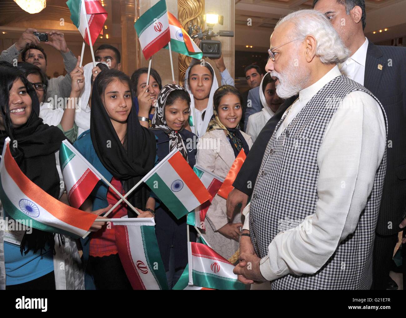 Indian Prime Minister Narendra Modi is welcomed by flag waving school ...
