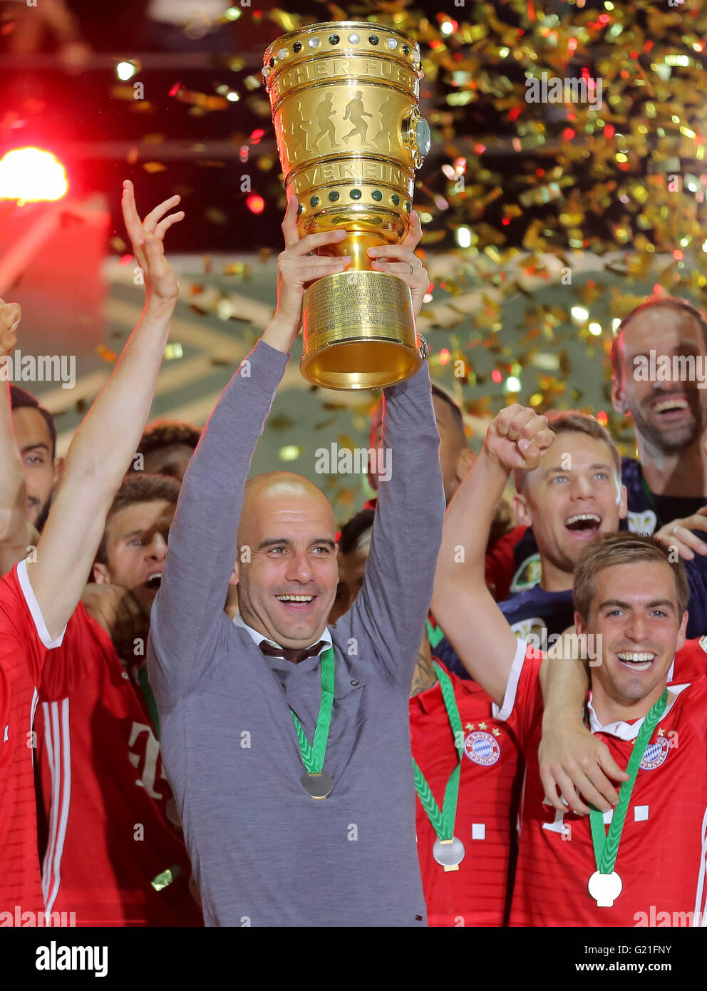Bayern coach Pep GUARDIOLA (FCB) celebrates with the trophy at the ...