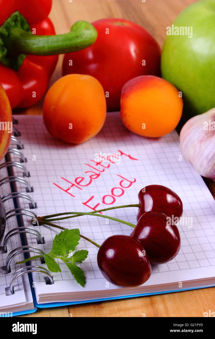 Fresh fruits and vegetables with notebook for writing notes, concept of ...