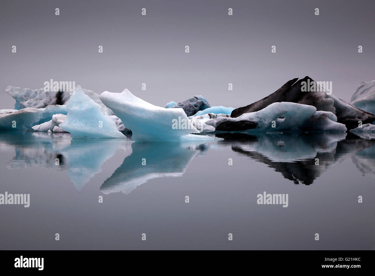 Ice, icebergs with traces of volcanic ash, glacier, glacial lagoon of ...