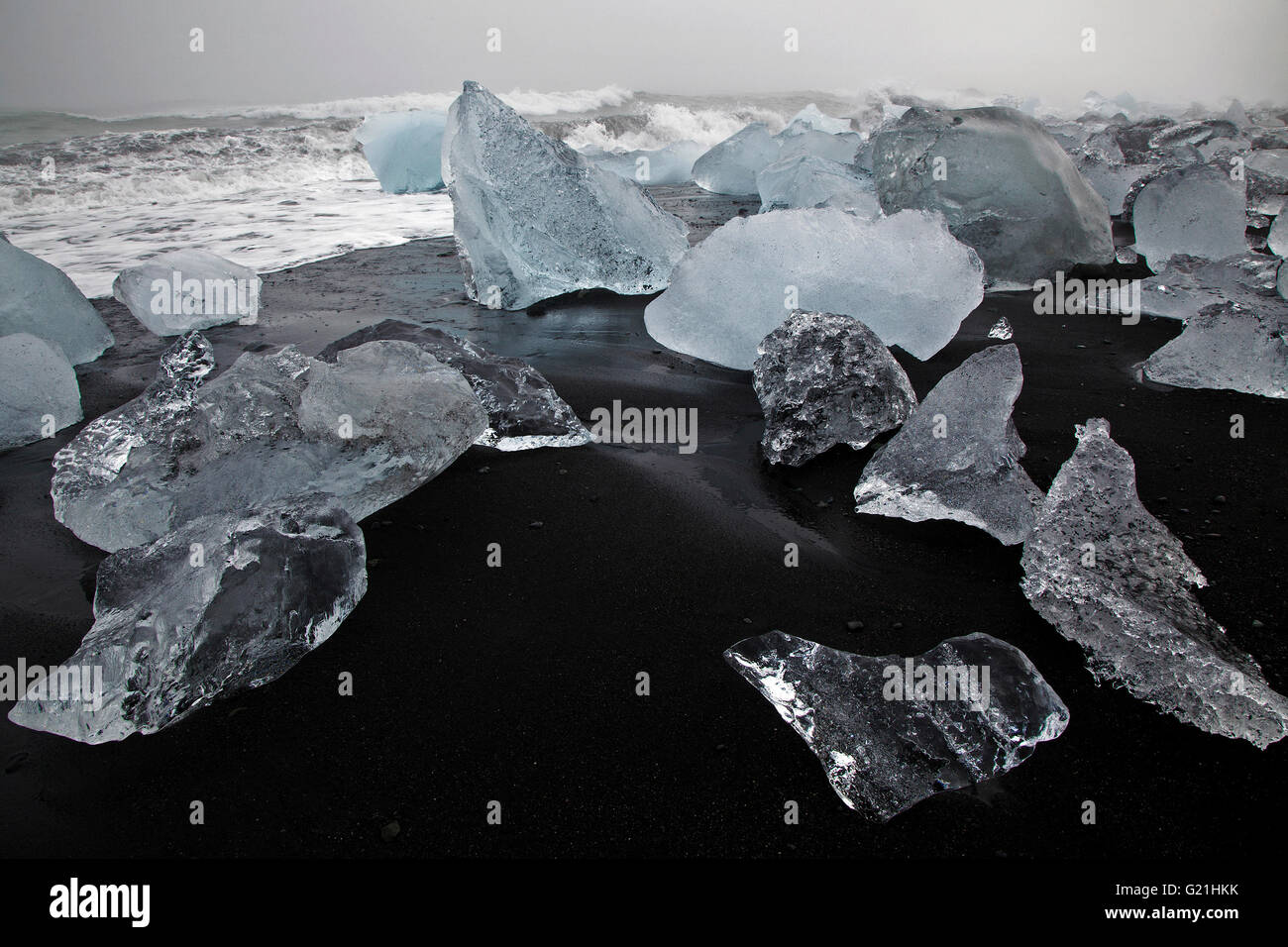 Chunks of floating ice, at the lava beach near Jökulsarlon, Iceland ...