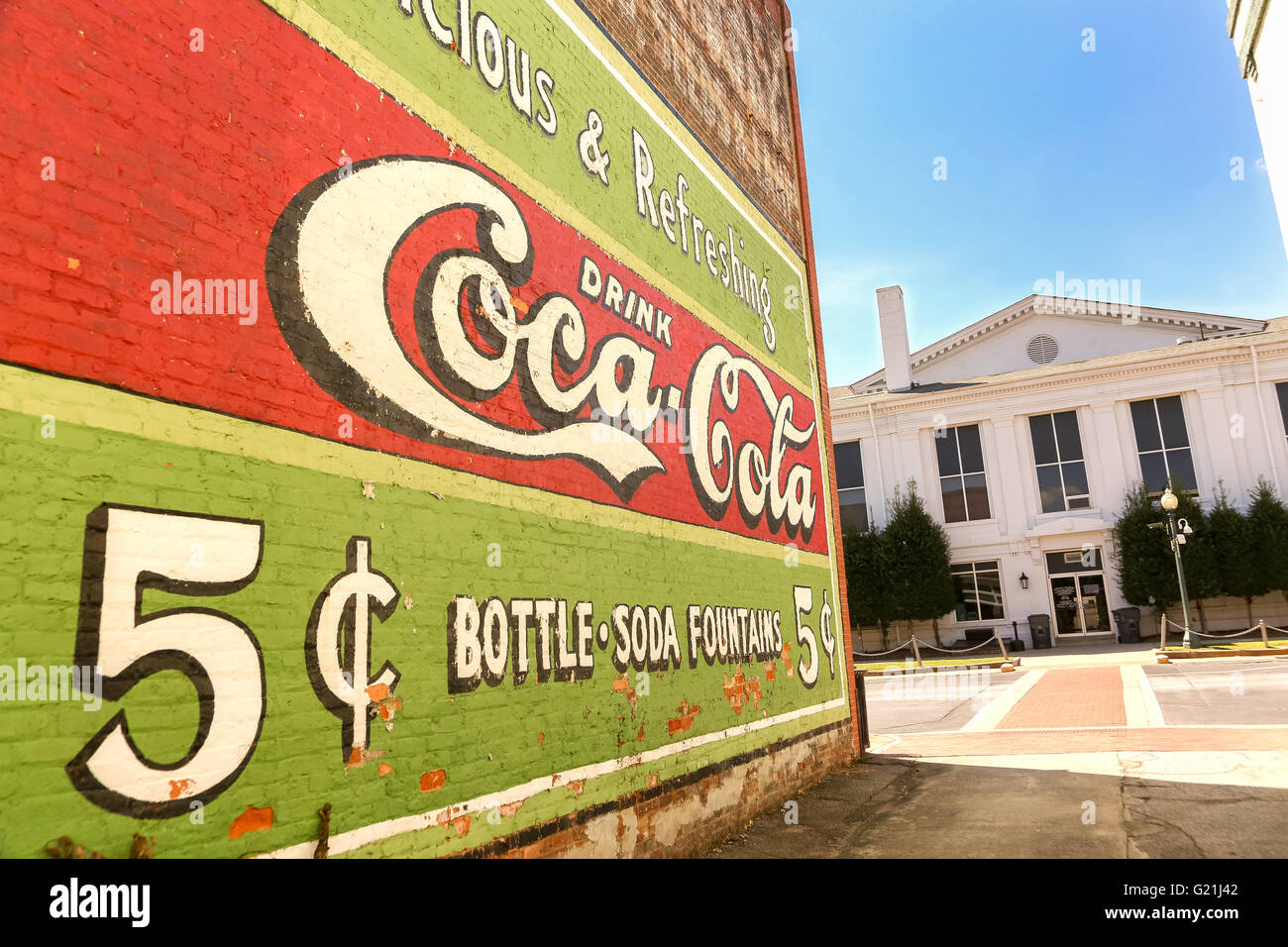 Old Coca Cola sign painted on a building and the historic County ...