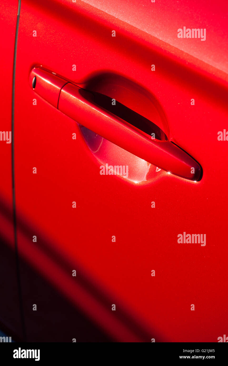 Color image of a red car door handle Stock Photo - Alamy