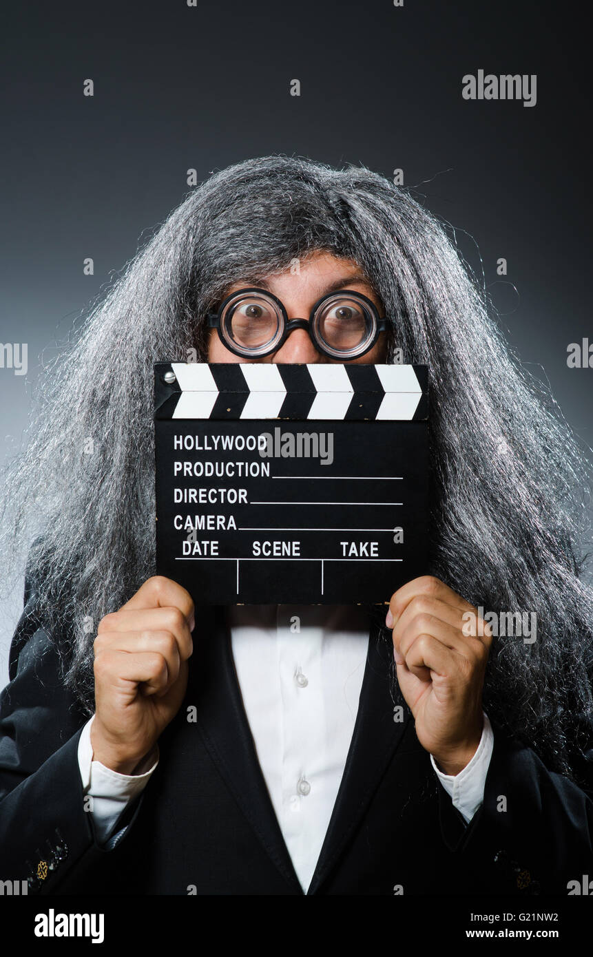 Funny man with movie clapboard Stock Photo - Alamy