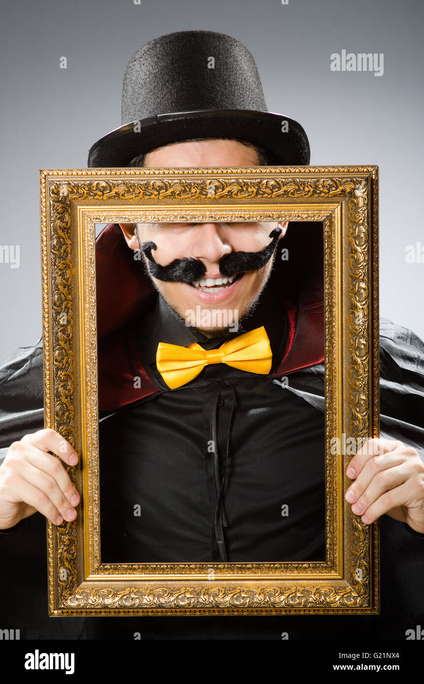 Funny man with picture frame Stock Photo - Alamy