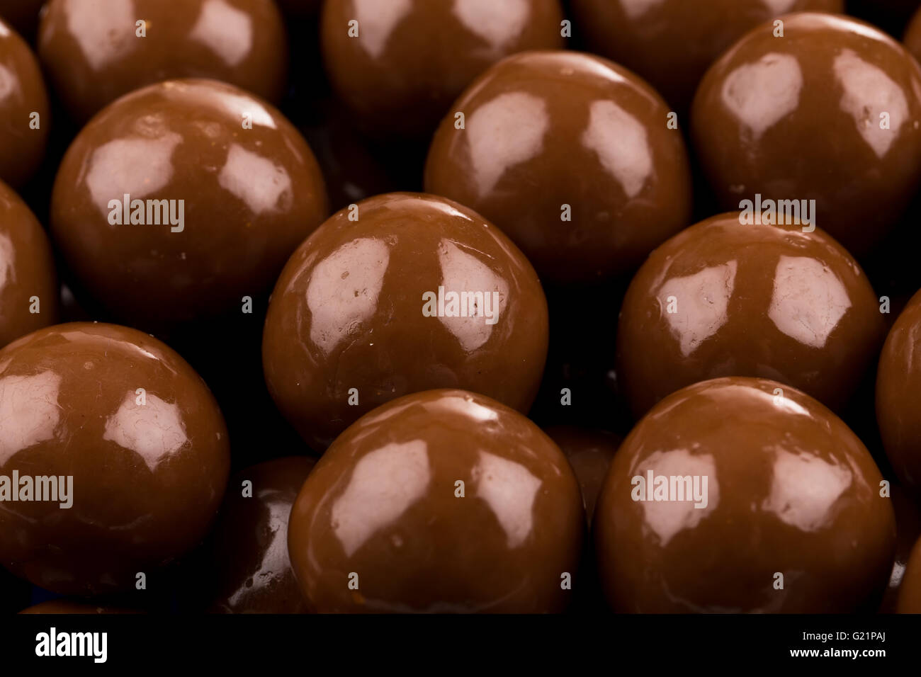 Multiple chocolate ball candies composition, isolated over the white ...