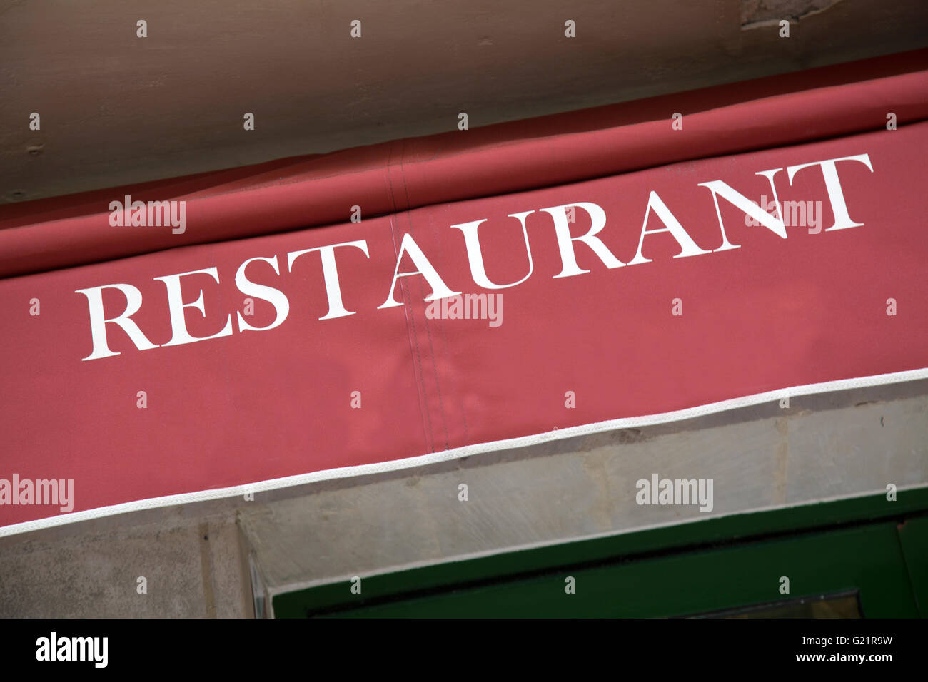 Red and White Restaurant Sign on Building Facade Stock Photo - Alamy