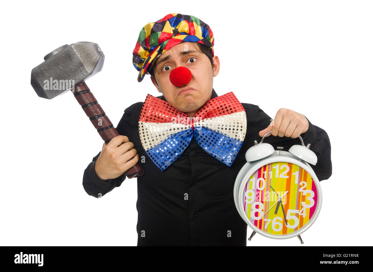 Funny clown with hammer and clock on white Stock Photo - Alamy