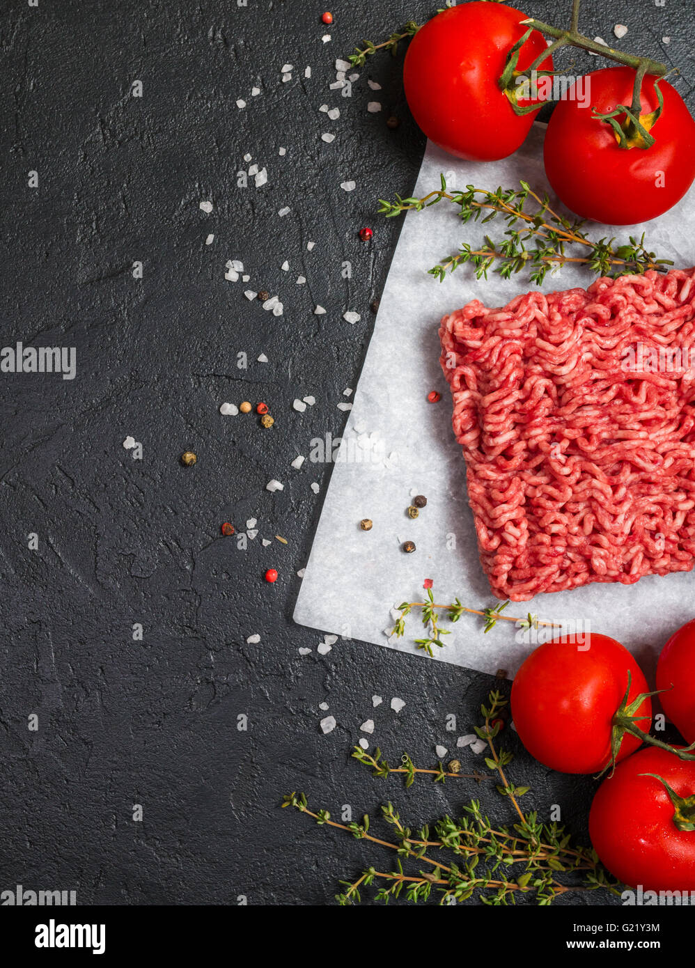 Minced meat with seasoning and fresh thyme Stock Photo - Alamy