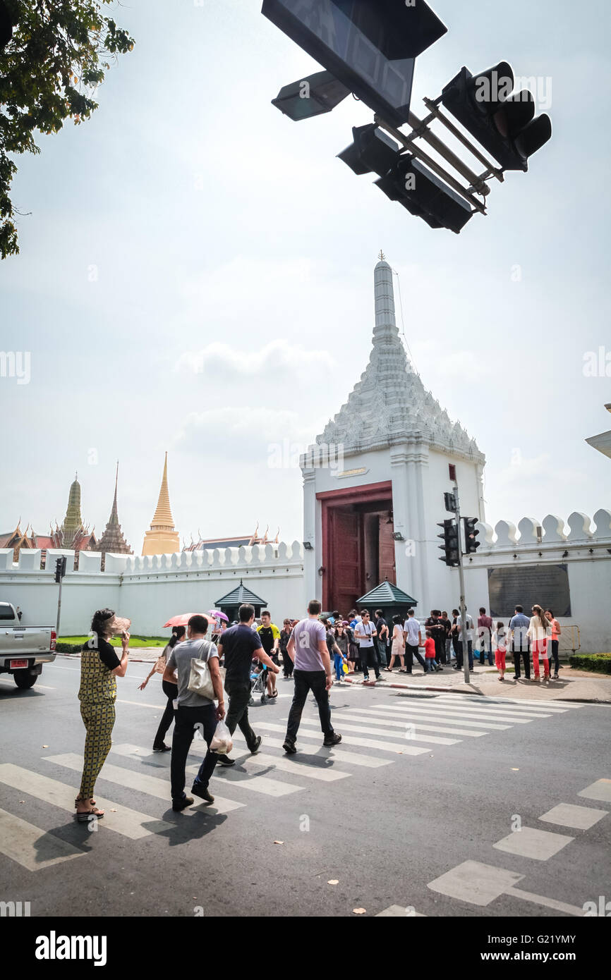 Pedestrians walking on a crosswalk in front of Grand Palace complex in ...