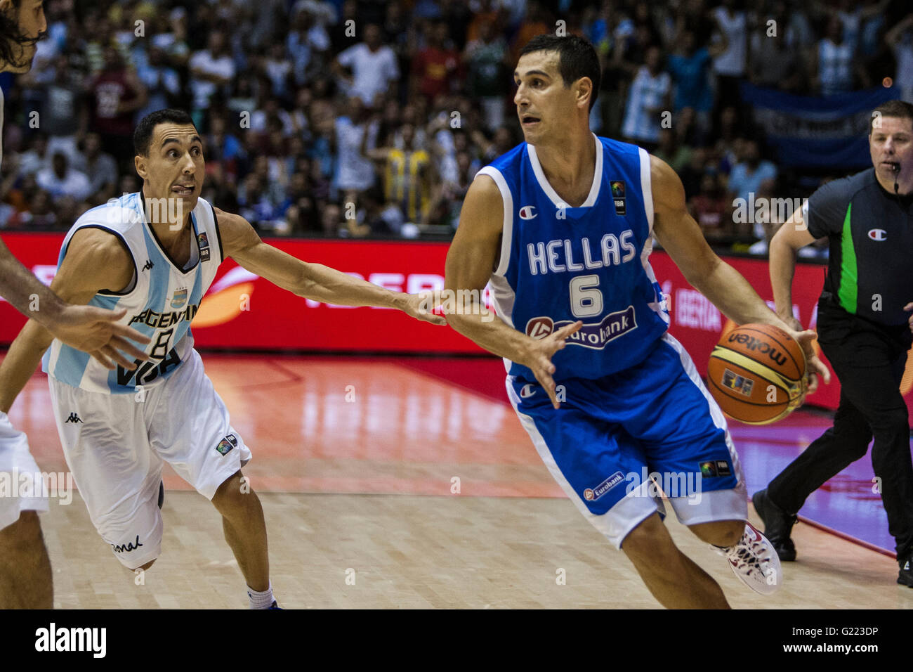 Nikos Zisis (R ), player of Greece, drives the ball and Pablo Prigioni ...