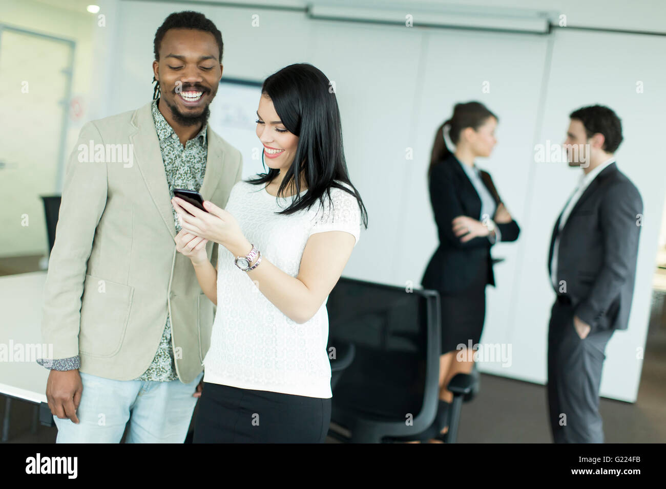 Young multiracial business people working together in the office Stock ...