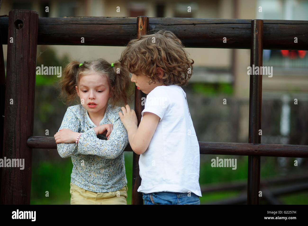 Little girl crying in the playground and boy consoles her Stock Photo ...