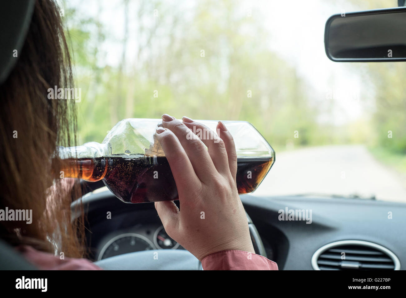 picture of woman drinking alcohol in the car Stock Photo - Alamy