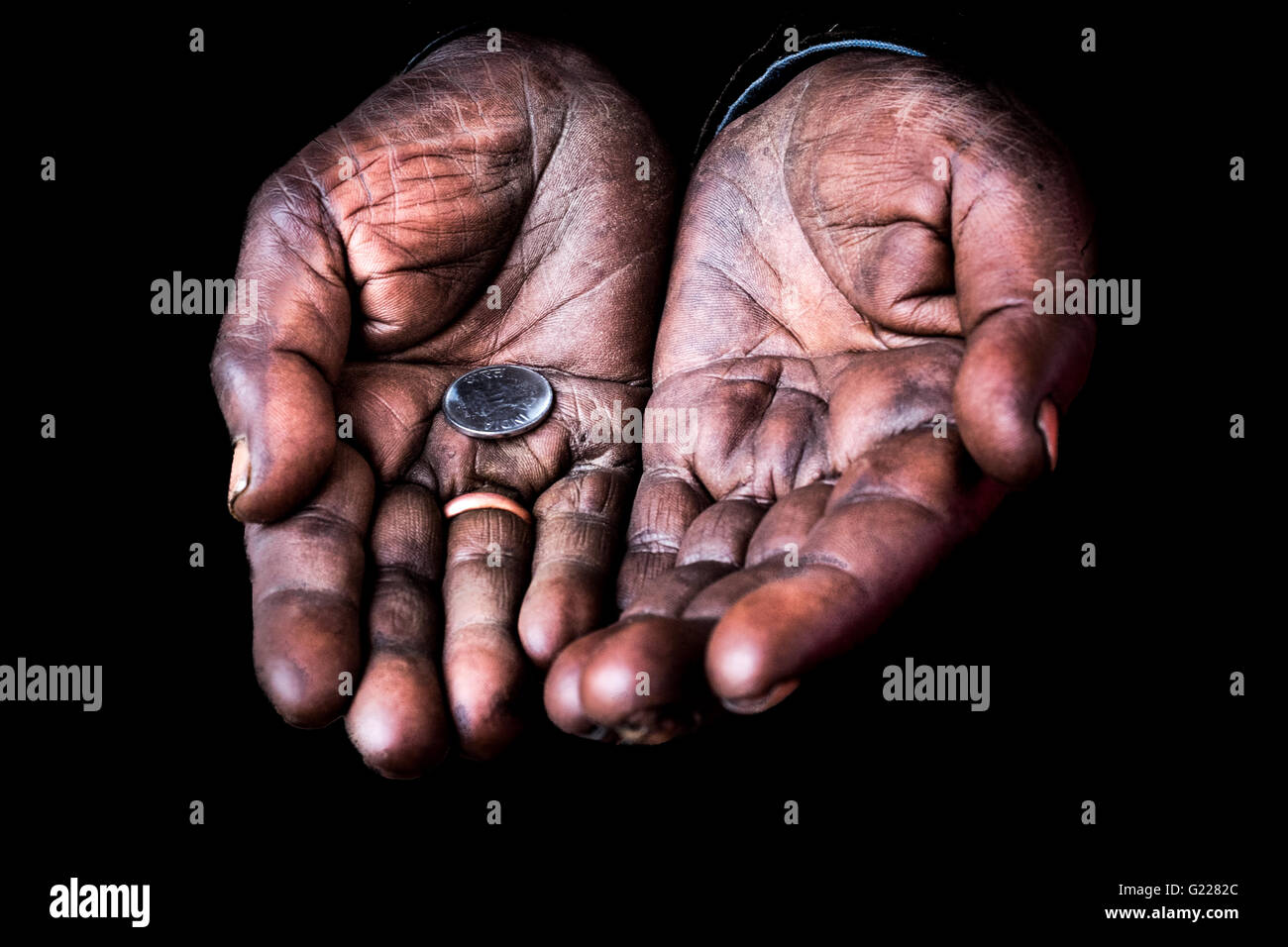 Hans of street beggar holding coin in Delhi, India Stock Photo - Alamy