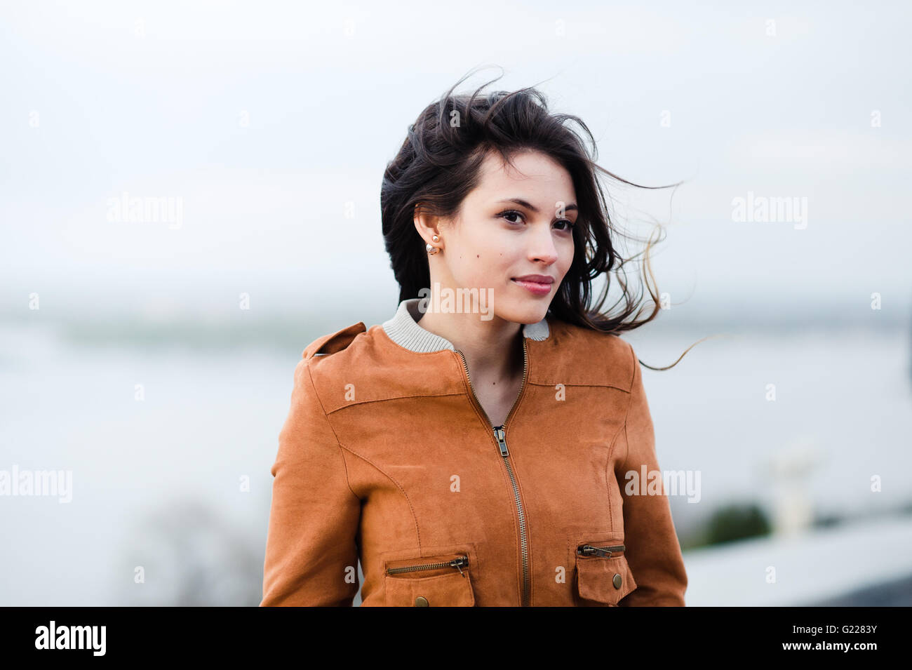 Portrait of a young smiling wanderer man traveler enjoying his ...