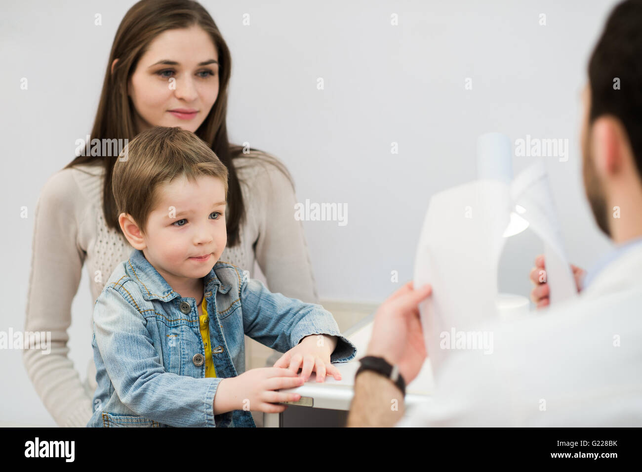 Little boy with mum on control pediatric visit at doctor's office Stock ...