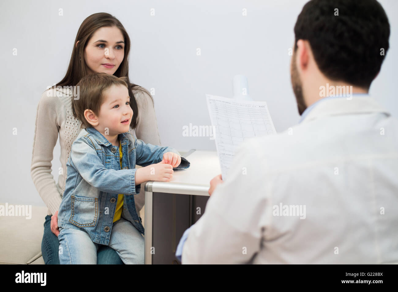 Little boy with mum on control pediatric visit at doctor's office Stock ...