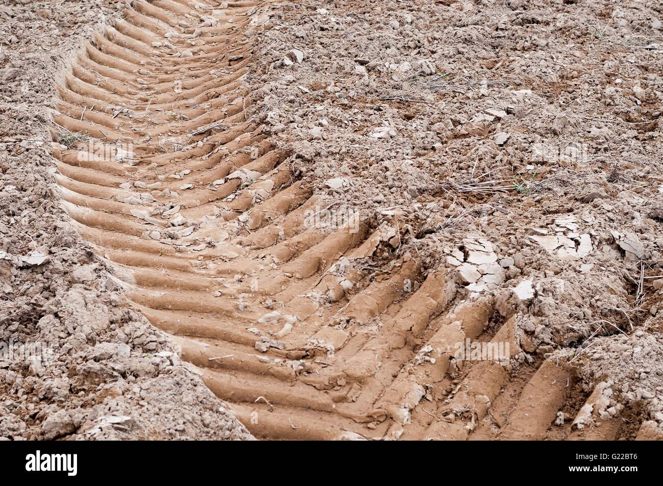 Tractor wheel tracks on the ground as background Stock Photo - Alamy