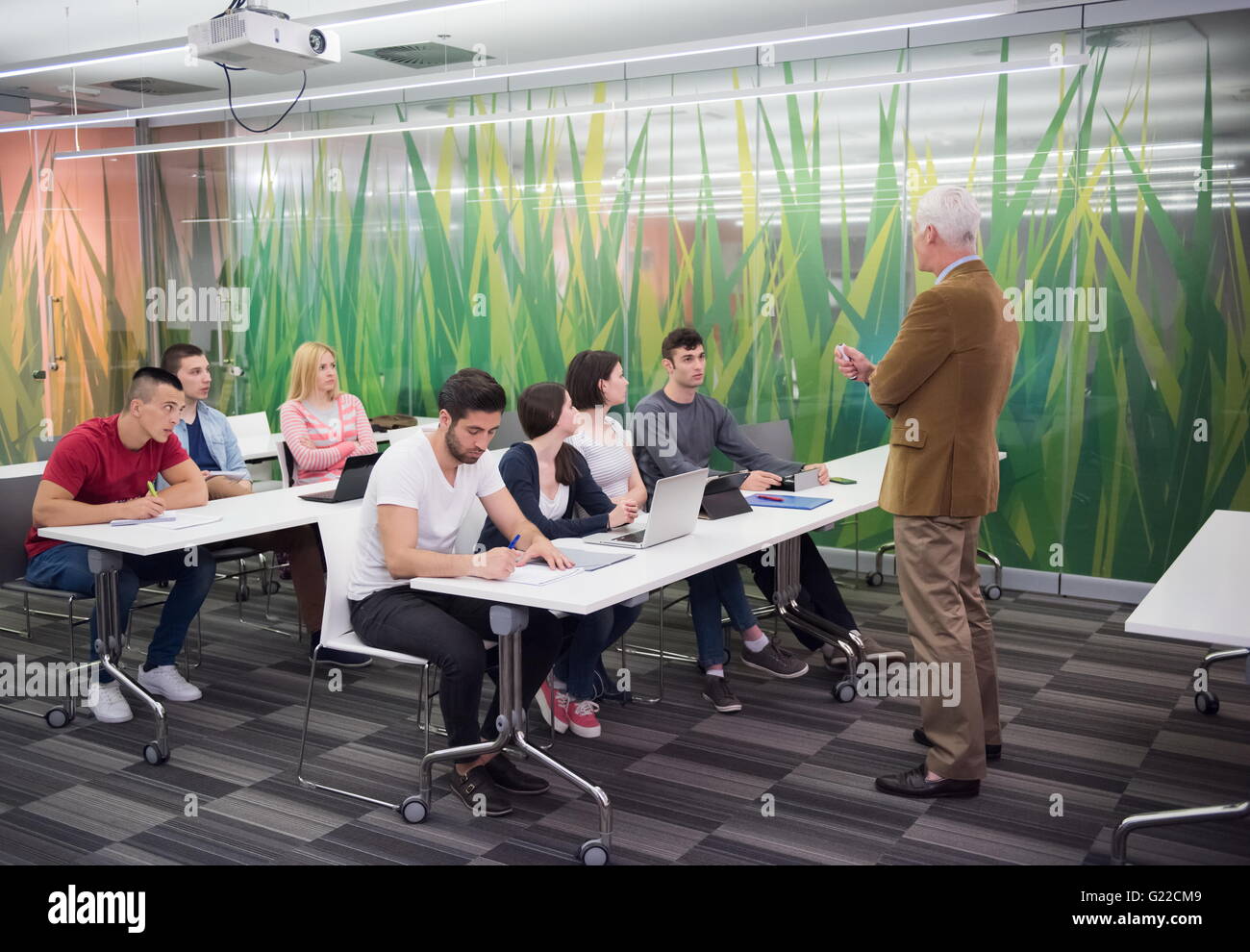 group of students study with professor in modern school classroom Stock ...