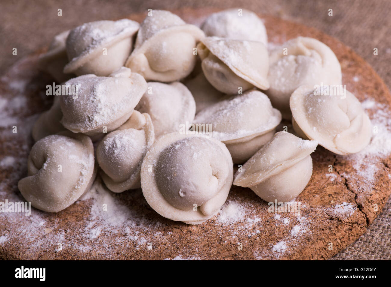 Uncooked dumplings Pelmeni. Traditional Russian dish. Background from ...