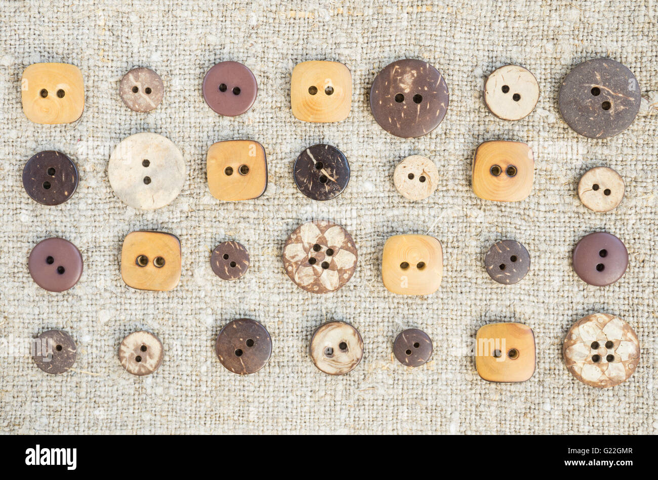 Many original buttons on canvas Stock Photo - Alamy