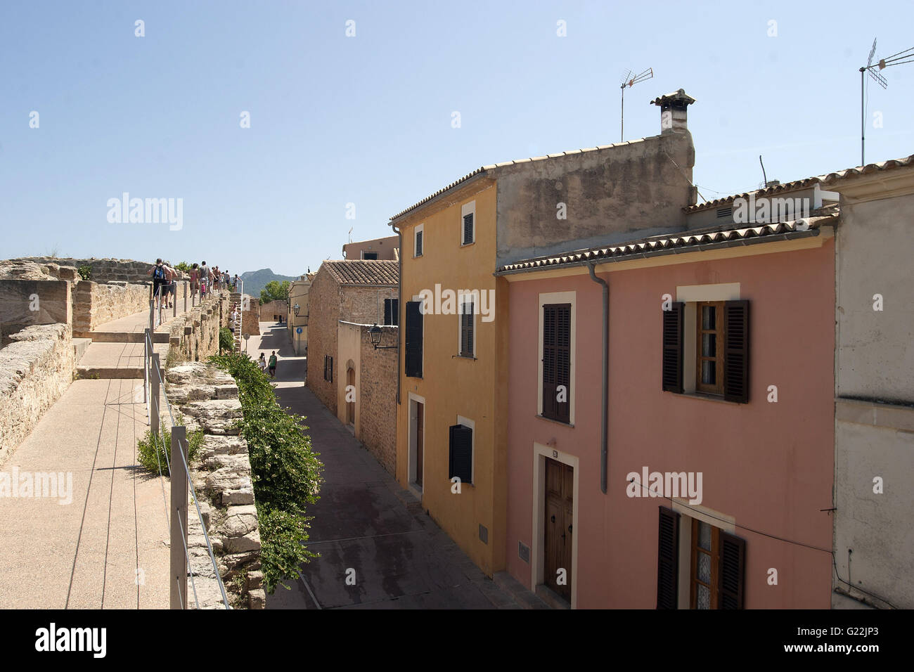 a beautiful photo of Alcudia's Old Town fortress walls and the towns ...