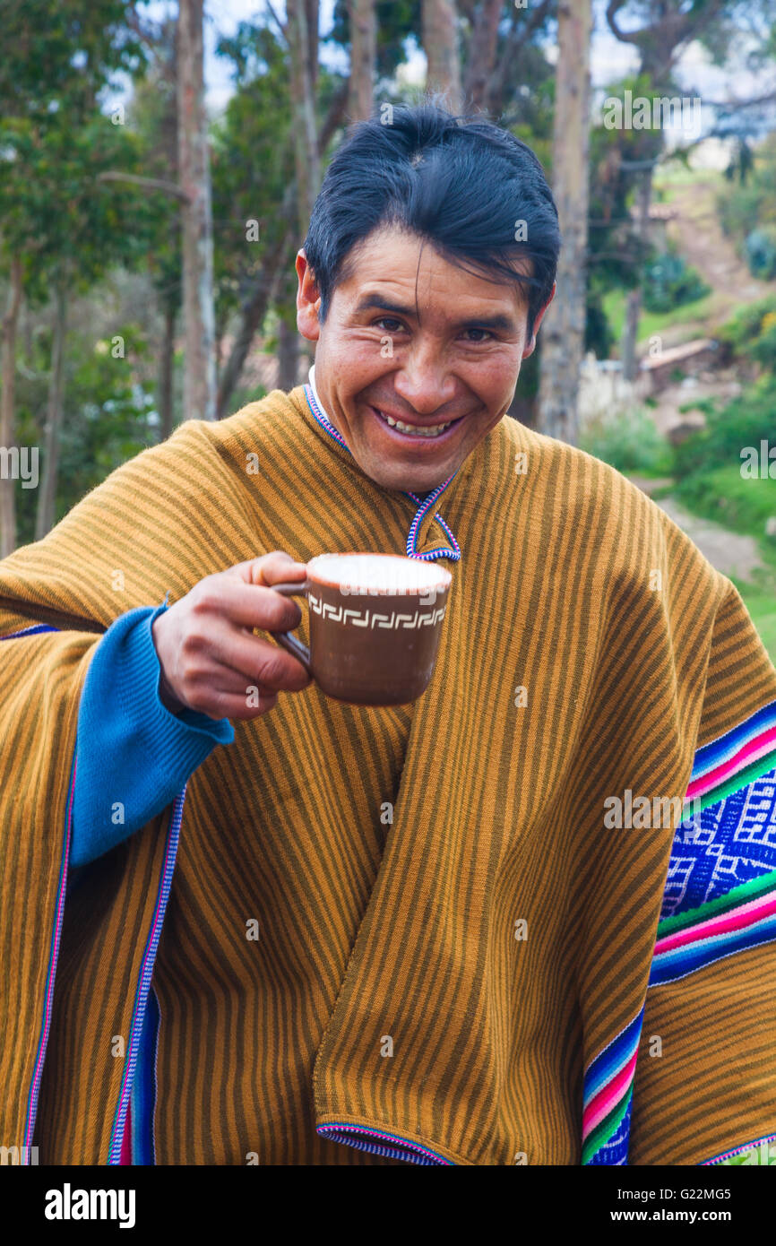Peruvian villager drinking corn beer in a ritual to thank Pachamama for ...