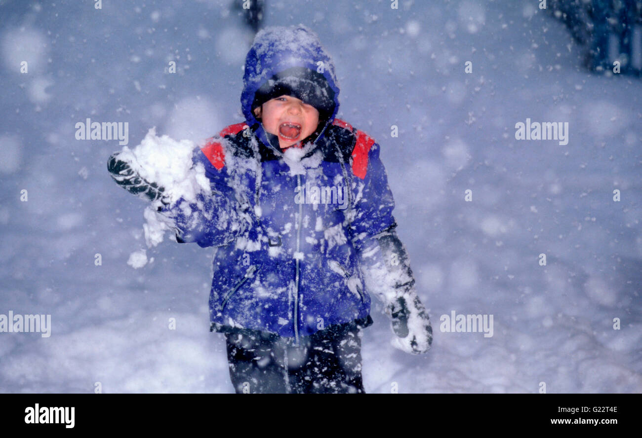 snowball fight fun happy happiness blizzard boy holding s Stock Photo ...