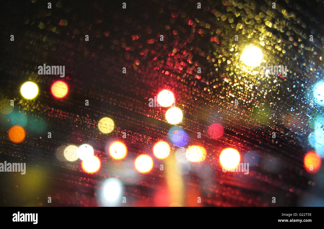 colorful lights shine through car windshield Stock Photo - Alamy