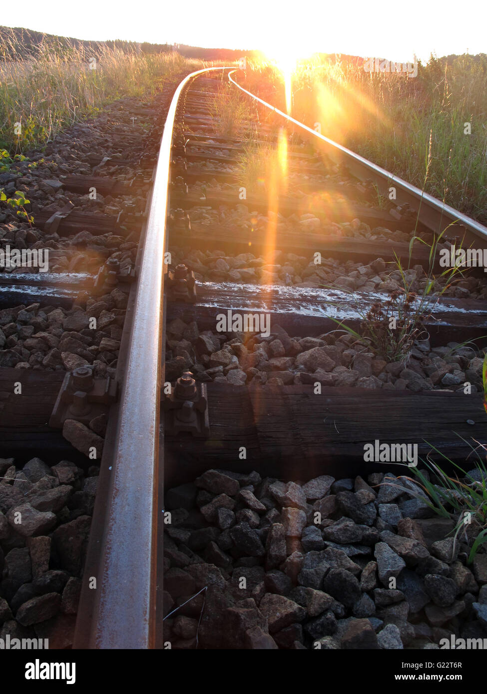 Czech Republic - Trebelovice. Train tracks with setting sun Stock Photo ...
