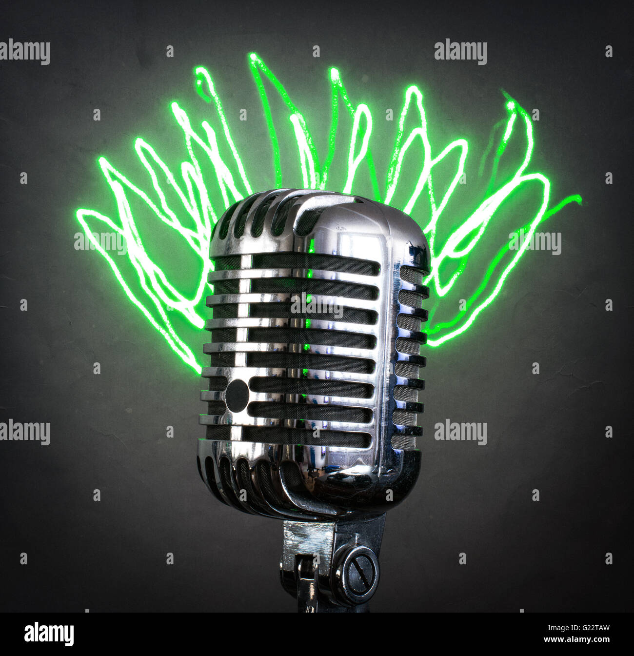 Retro microphone with green laser rays Stock Photo - Alamy