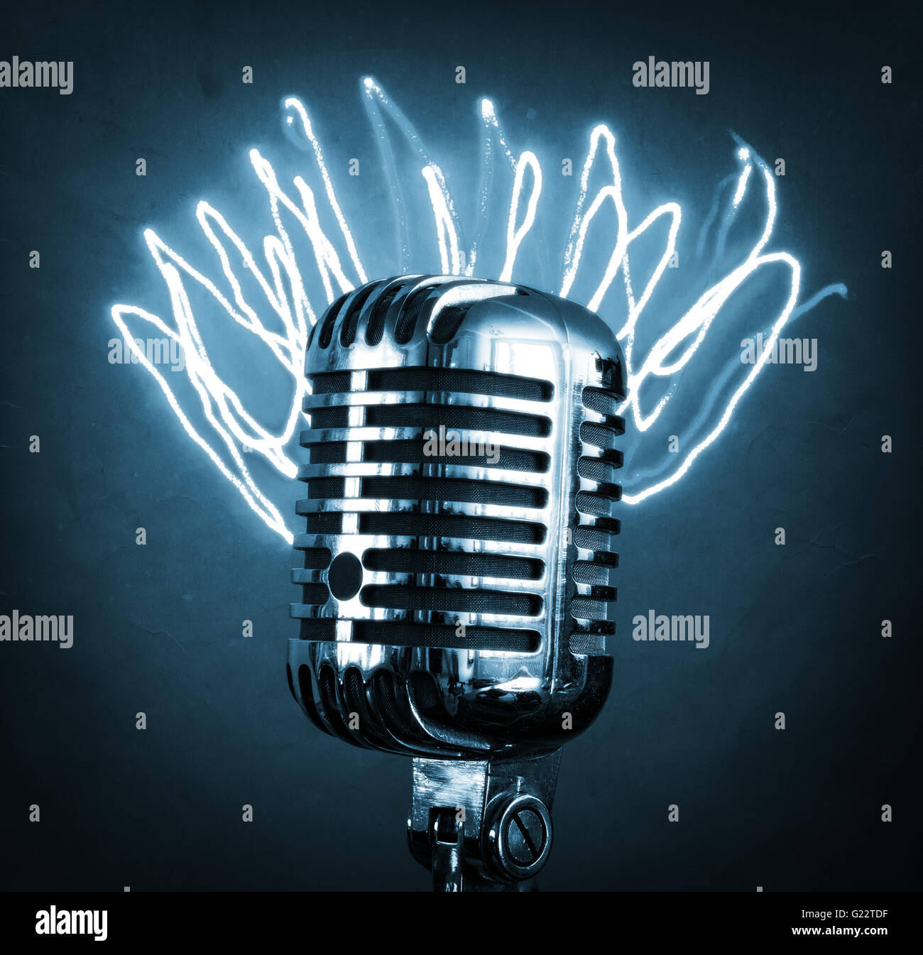Retro microphone with blue laser rays Stock Photo - Alamy