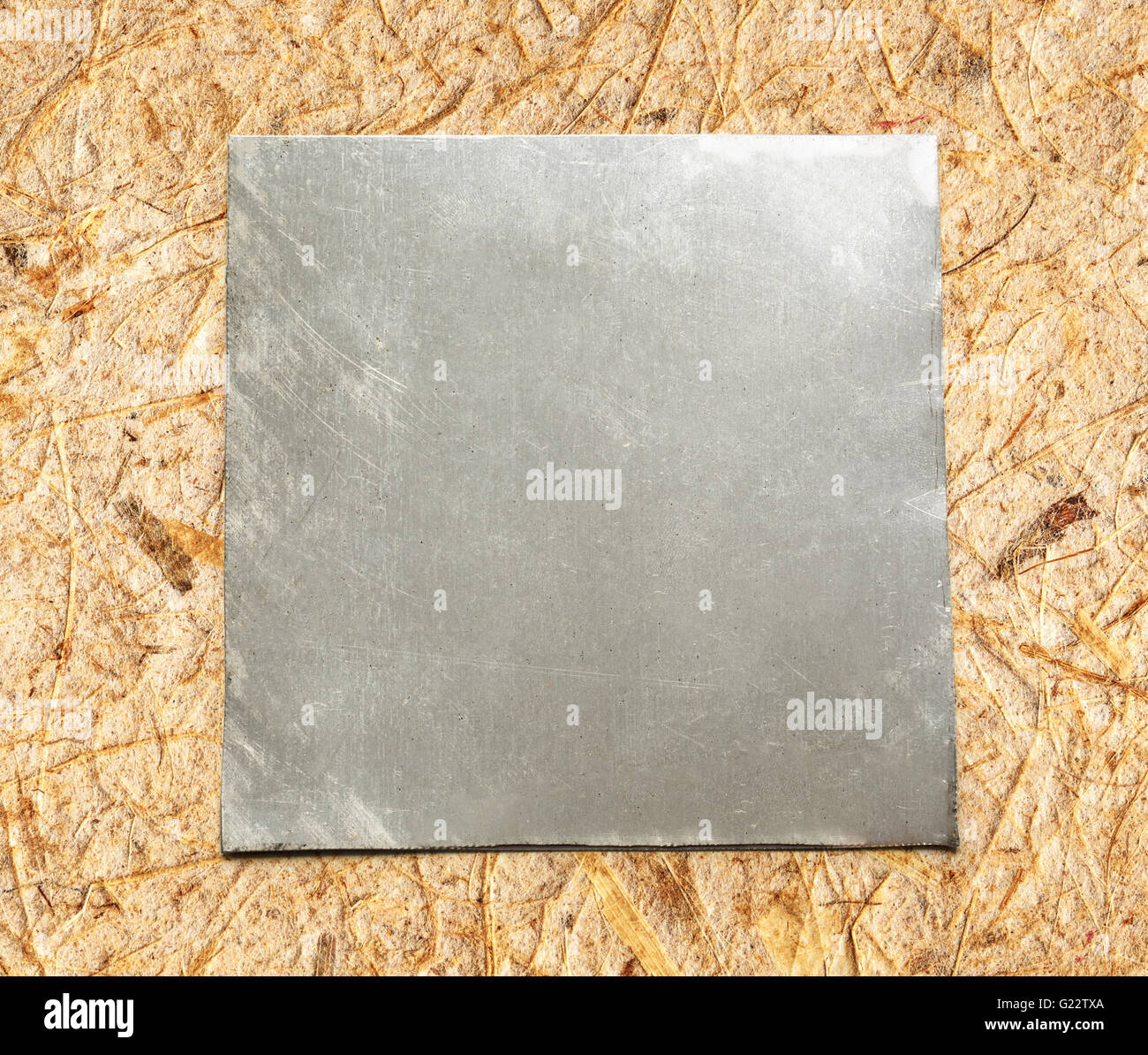 Blank square metal plate on wooden background Stock Photo - Alamy