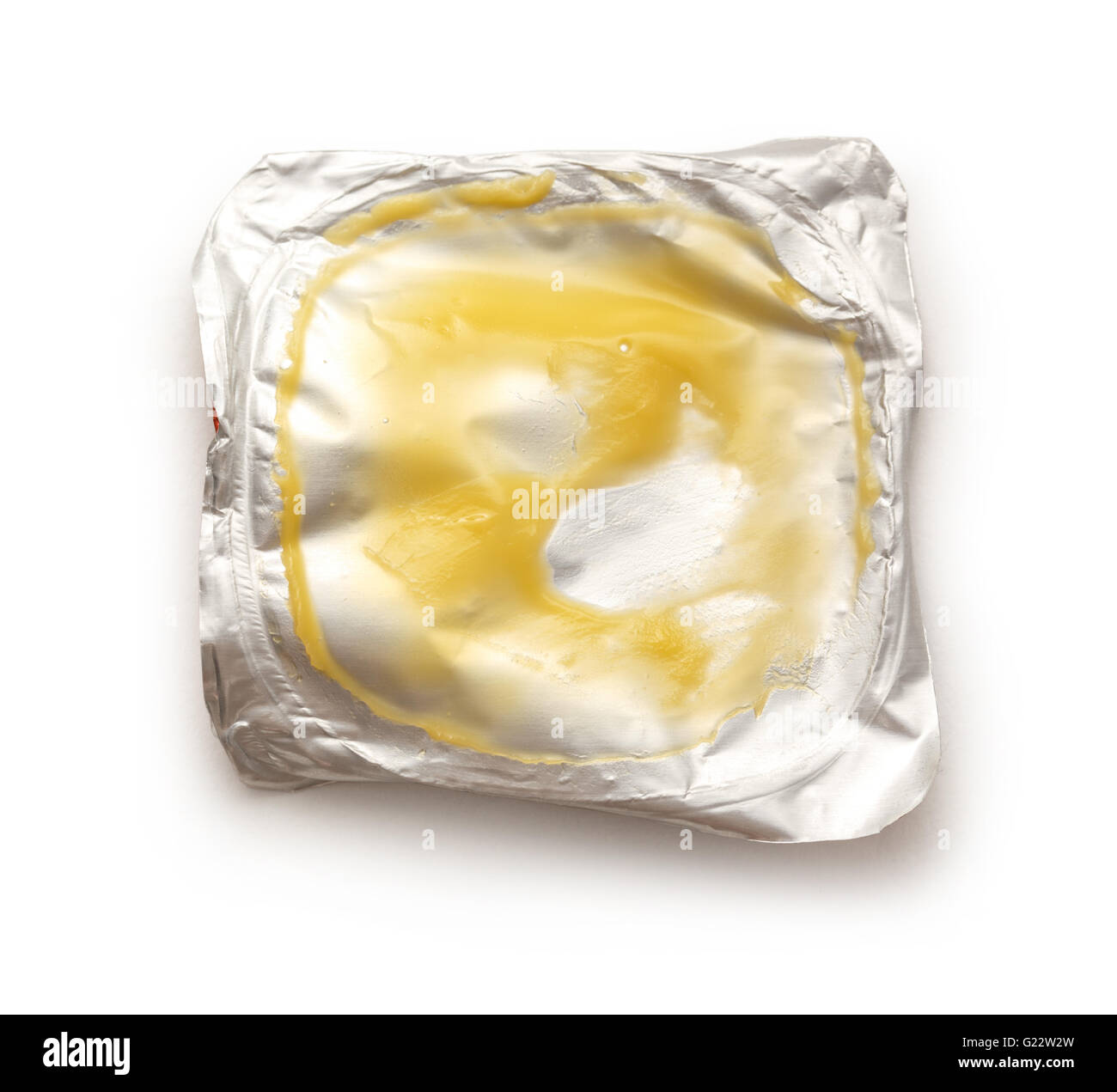 Used part of yogurt package on white Stock Photo - Alamy