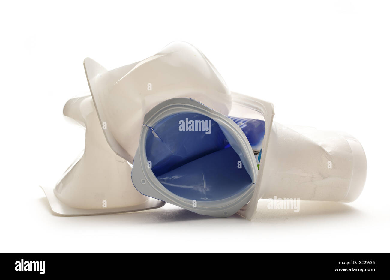 Empty crushed plastic yogurt pots on white Stock Photo - Alamy