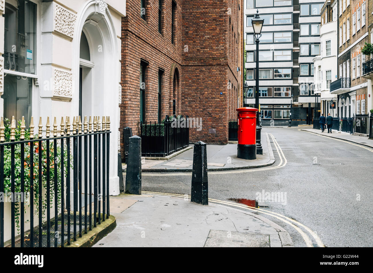 Red mailbox in a street of London Stock Photo - Alamy