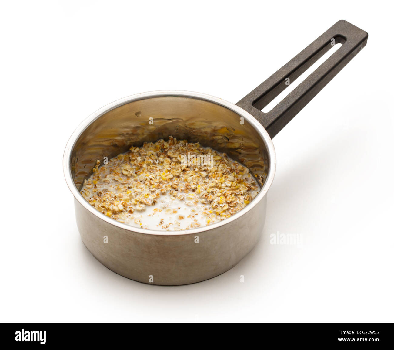 Cooking healthy porridge in metal pot closeup Stock Photo - Alamy