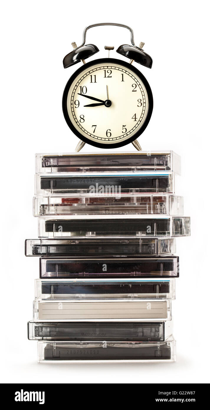 Stack of old cassettes and alarm clock Stock Photo - Alamy