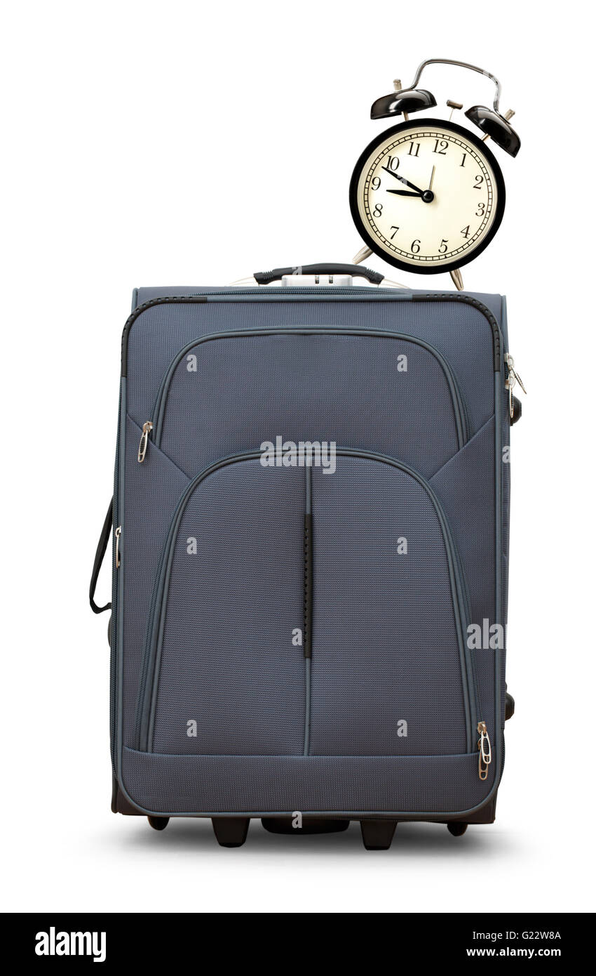 Large gray suitcase on wheels and alarm clock Stock Photo - Alamy