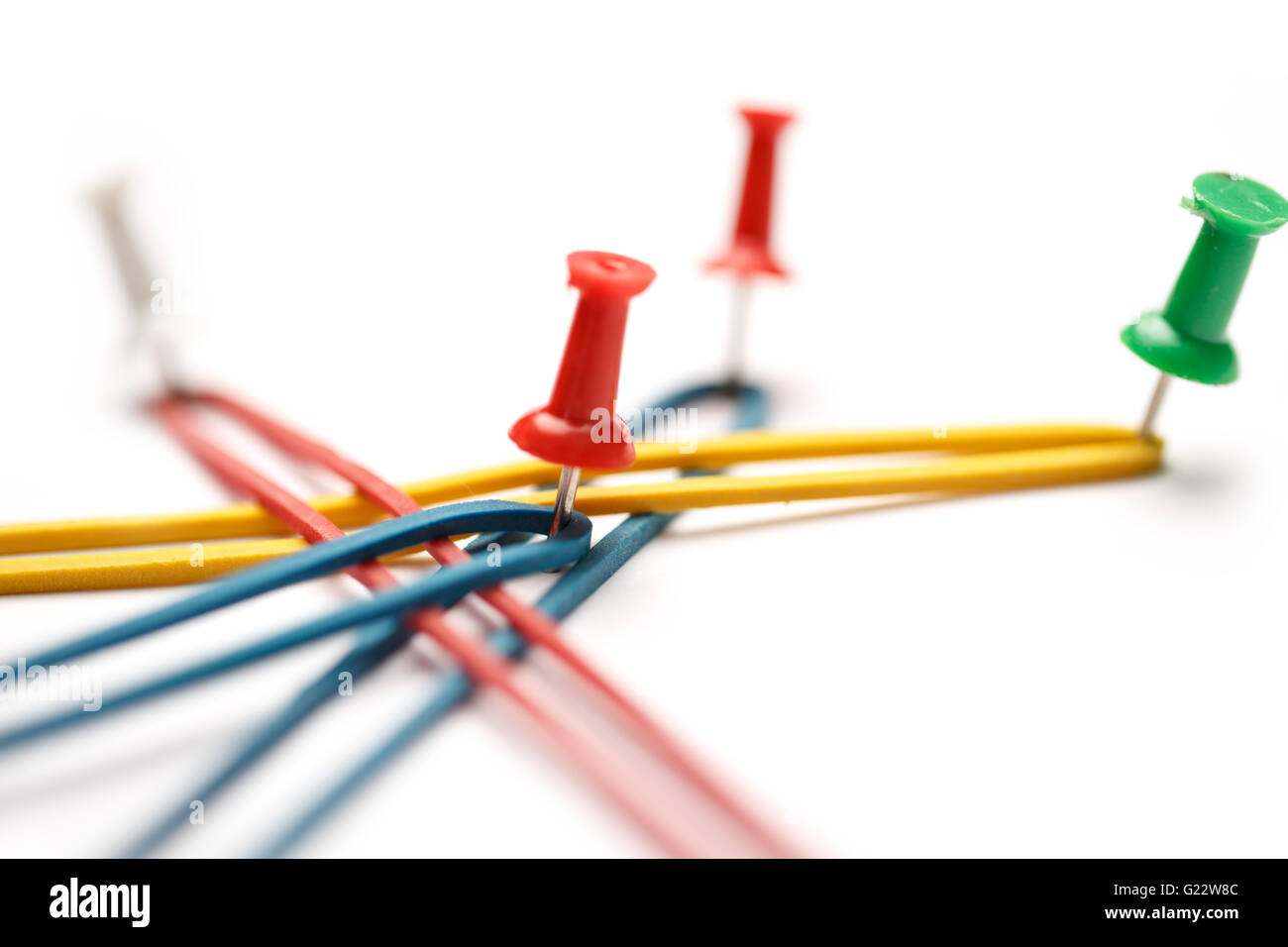 Colorful paper pins attached to white paper Stock Photo - Alamy