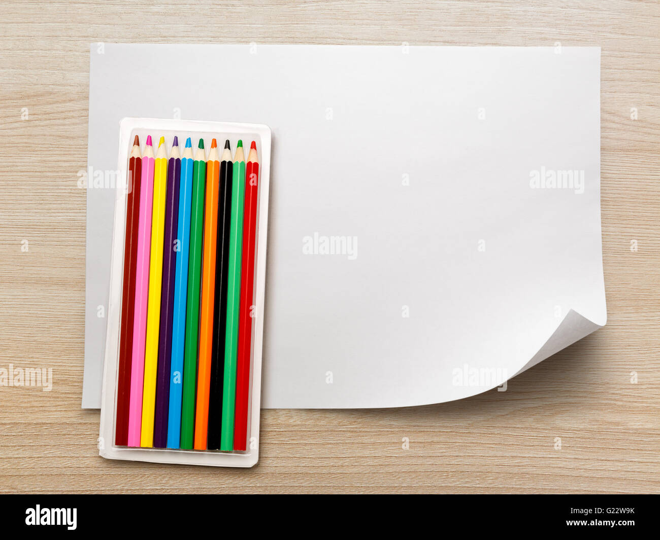 Set of new colourful pencils on blank paper Stock Photo - Alamy