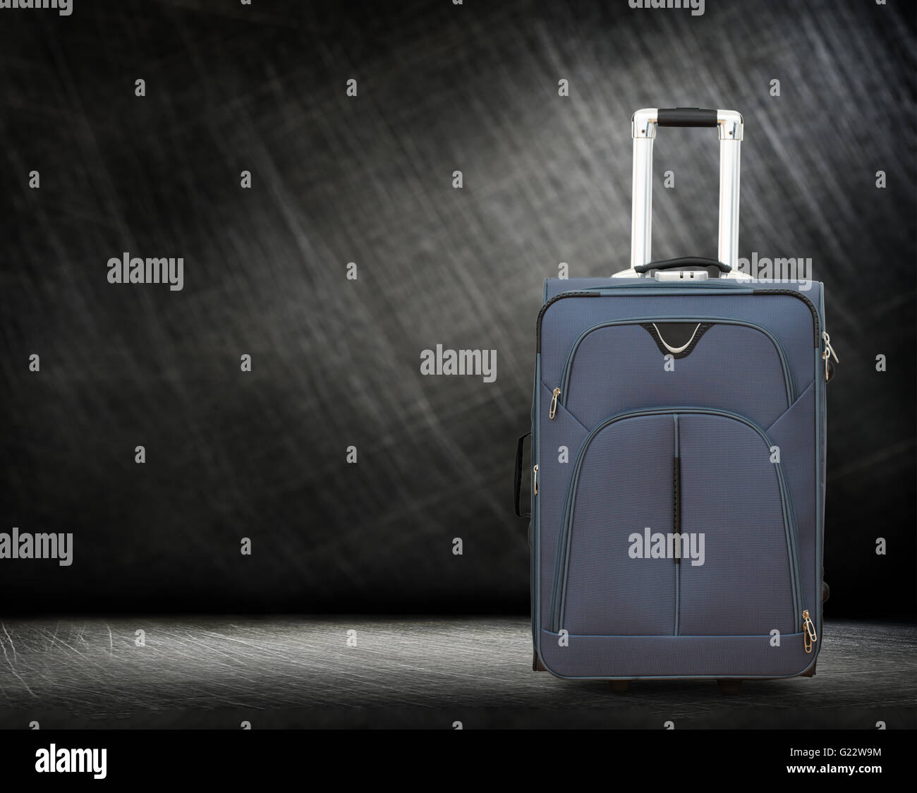 Large gray suitcase on wheels in closeup Stock Photo - Alamy