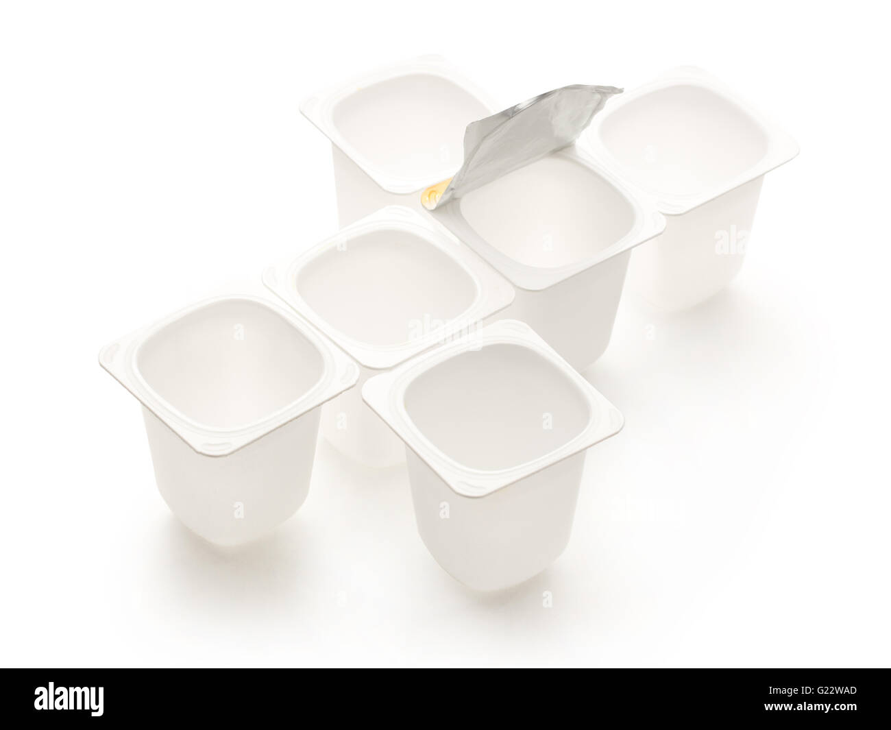 Empty crushed plastic yogurt pots on white Stock Photo - Alamy