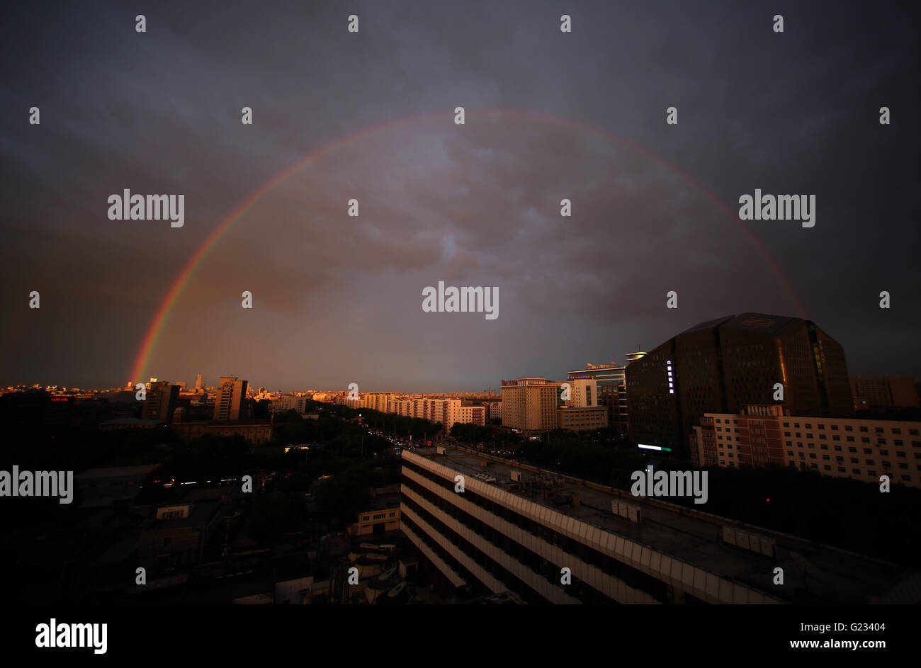 Beijing, China. 23rd May, 2016. A rainbow appears after a small rain in ...
