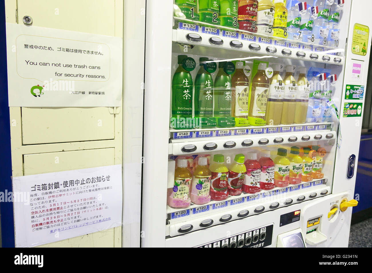 Signs reading temporary suspended trash cans for security on display at ...