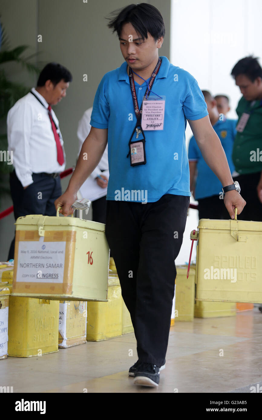 Quezon City, Philippines. 24th May, 2016. An employee carries ballot ...