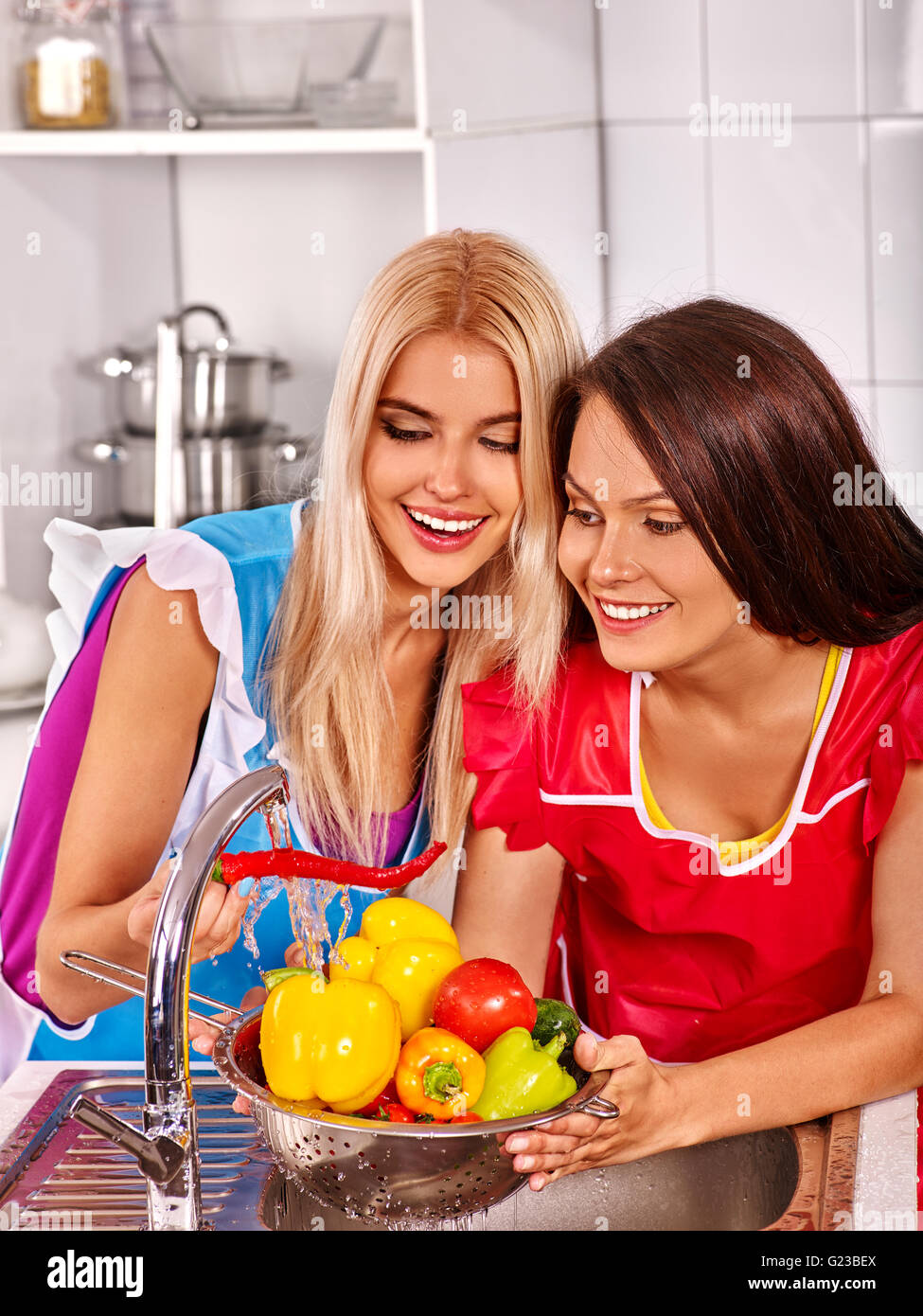 Women washing vegetables at kitchen Stock Photo - Alamy