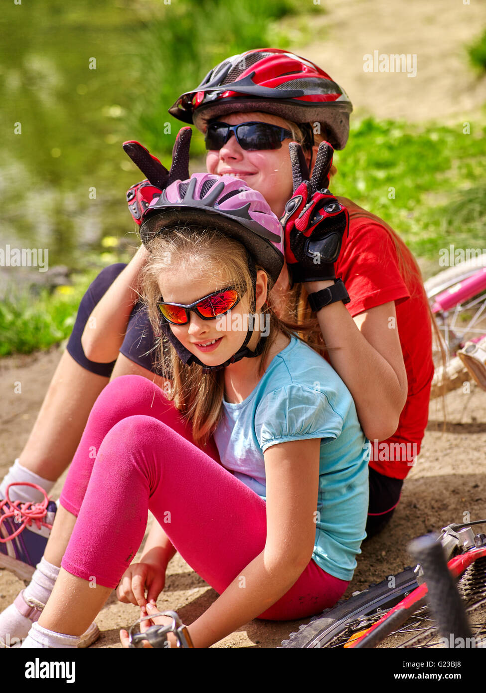 Happy mother daughter rides bicycle hi-res stock photography and images ...